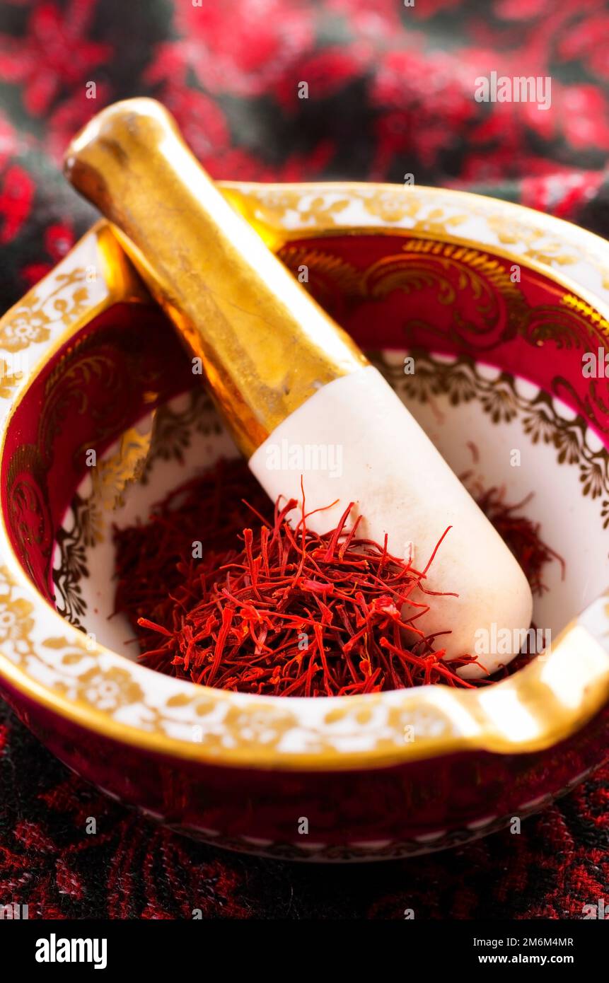 Saffron in the mortar Stock Photo - Alamy