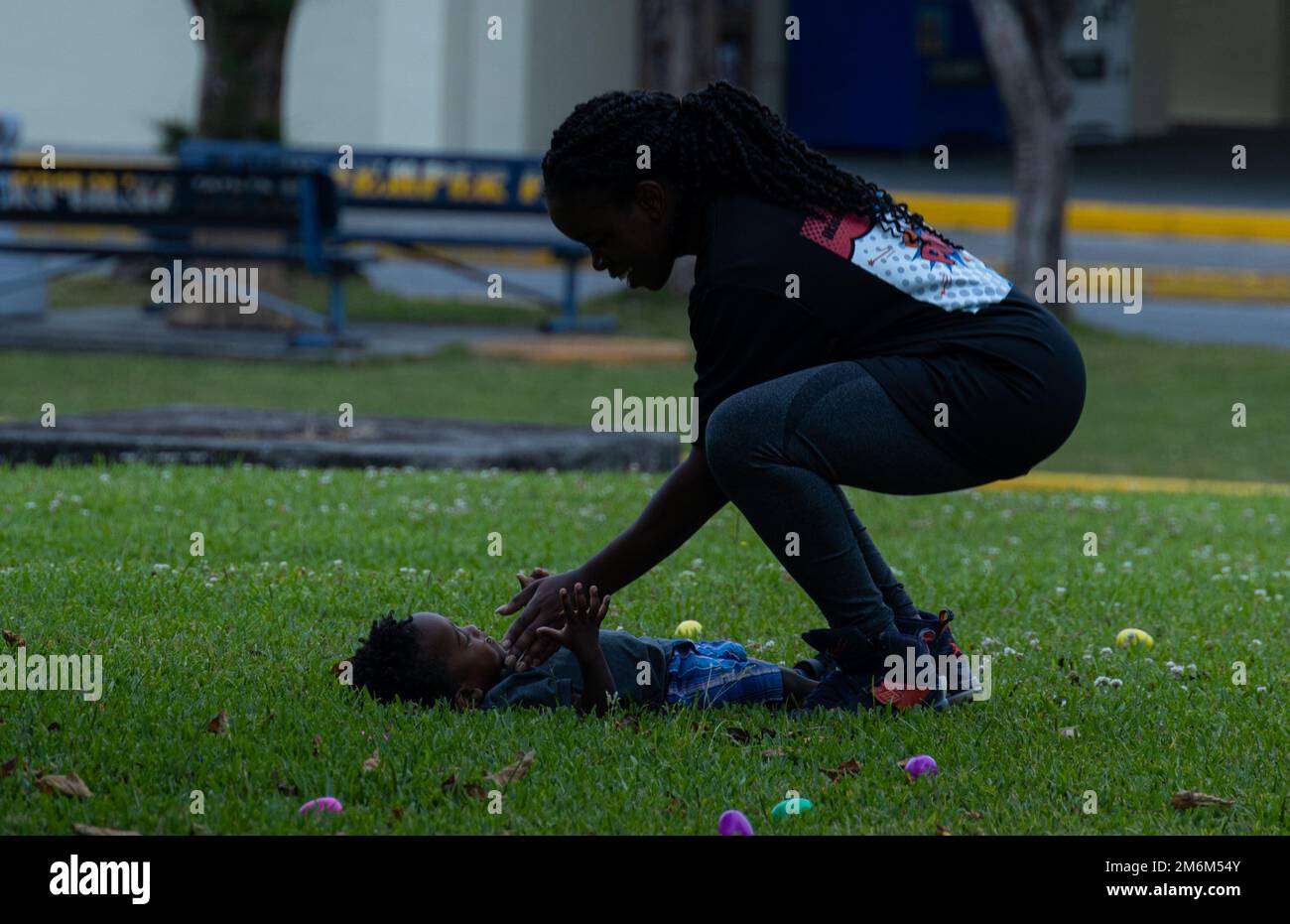 A mother and her child play outside the Camp Foster Community Center ...