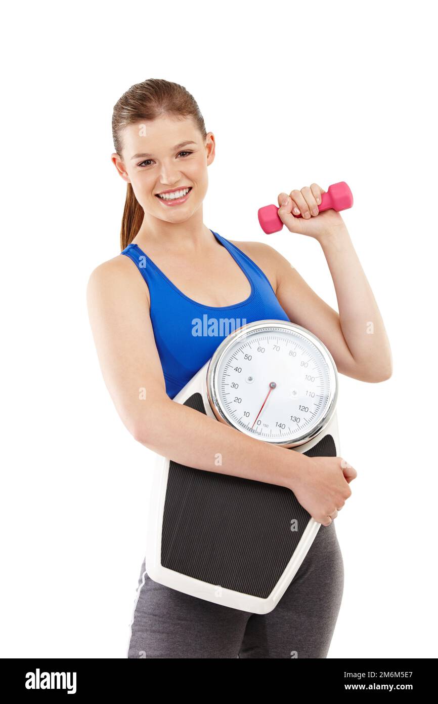 Lifting weights to lose weight. A pretty teenager holding a weight in ...