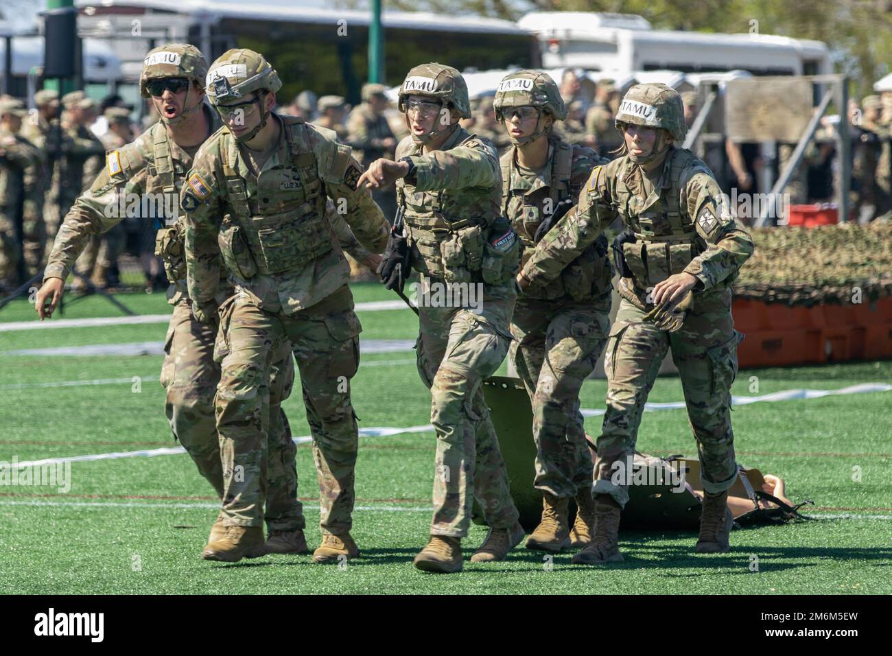 Working together, Texas A&M drags one of their combat casualties toward ...