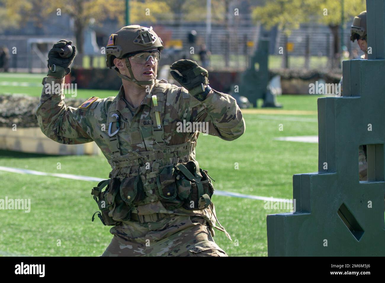 Cadet Ian Bryan, University of North Georgia, throws a grenade toward ...