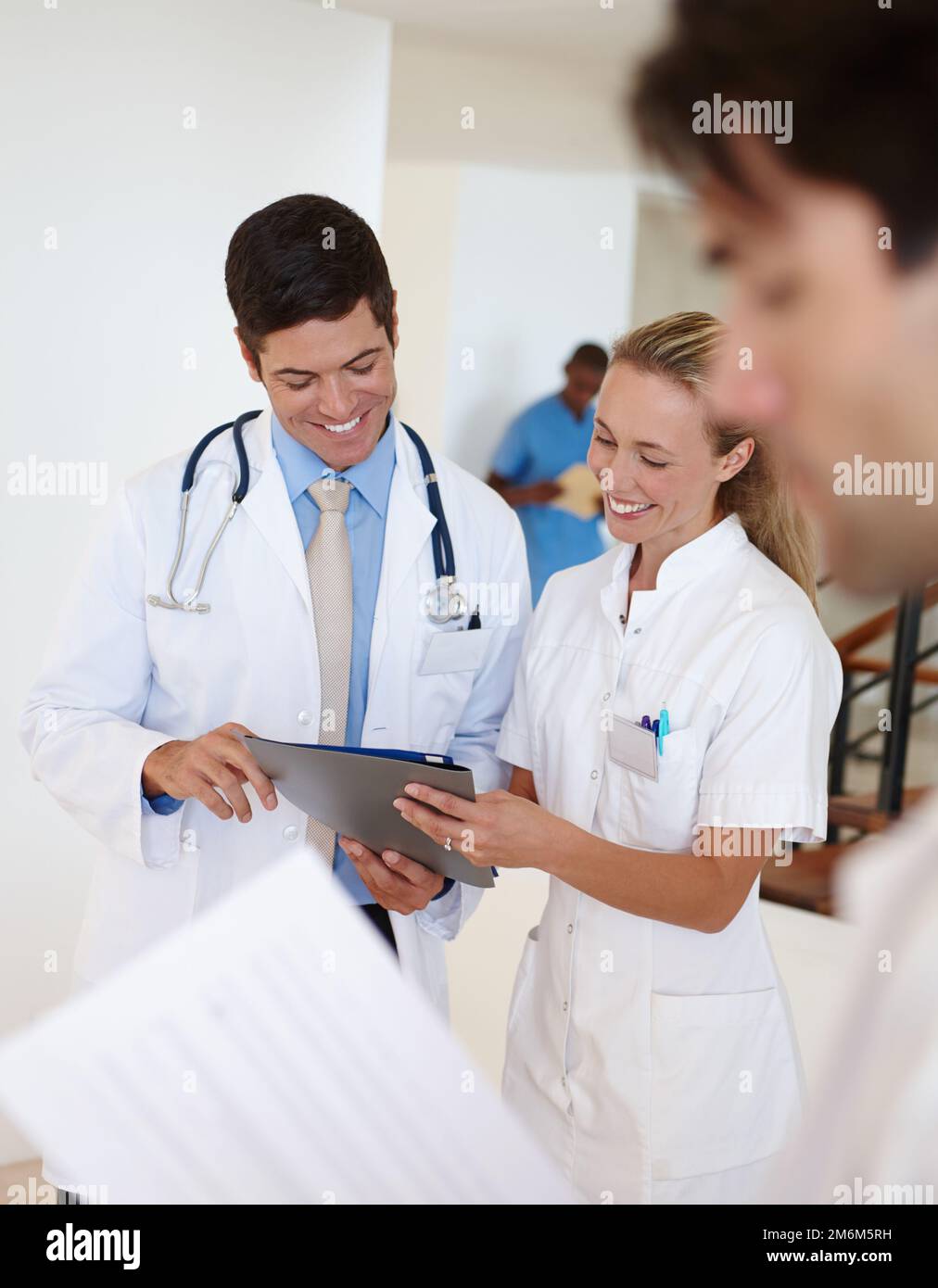 Discussing treatment specifics. a male doctor and a female nurse ...