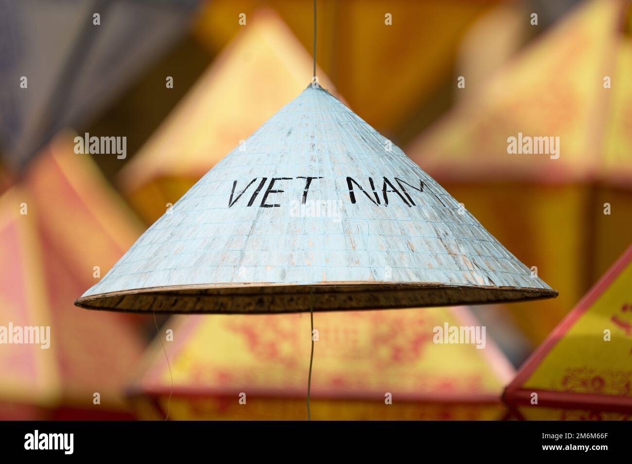 Hue, Vietnam. 20th Nov, 2022. Lanterns and a cone hat hang in the ...