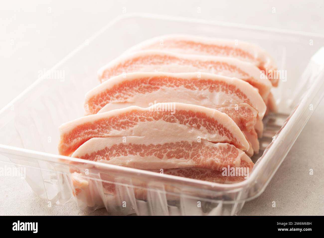 Fresh neck meat in packaging container Stock Photo - Alamy