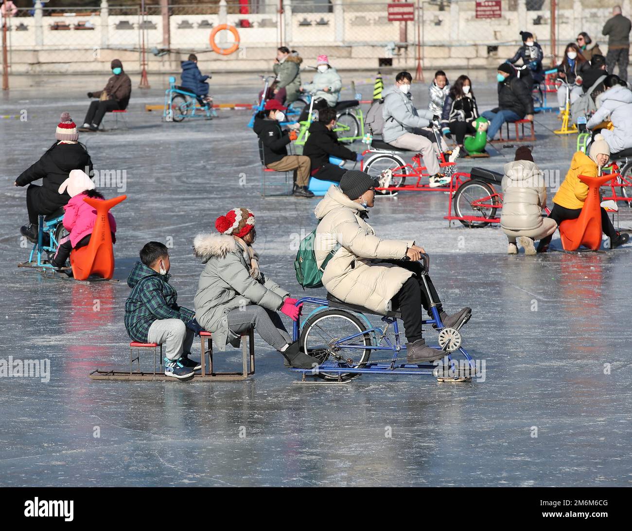Visitors play at the ice rink in Beihai Park on the last day of the New ...