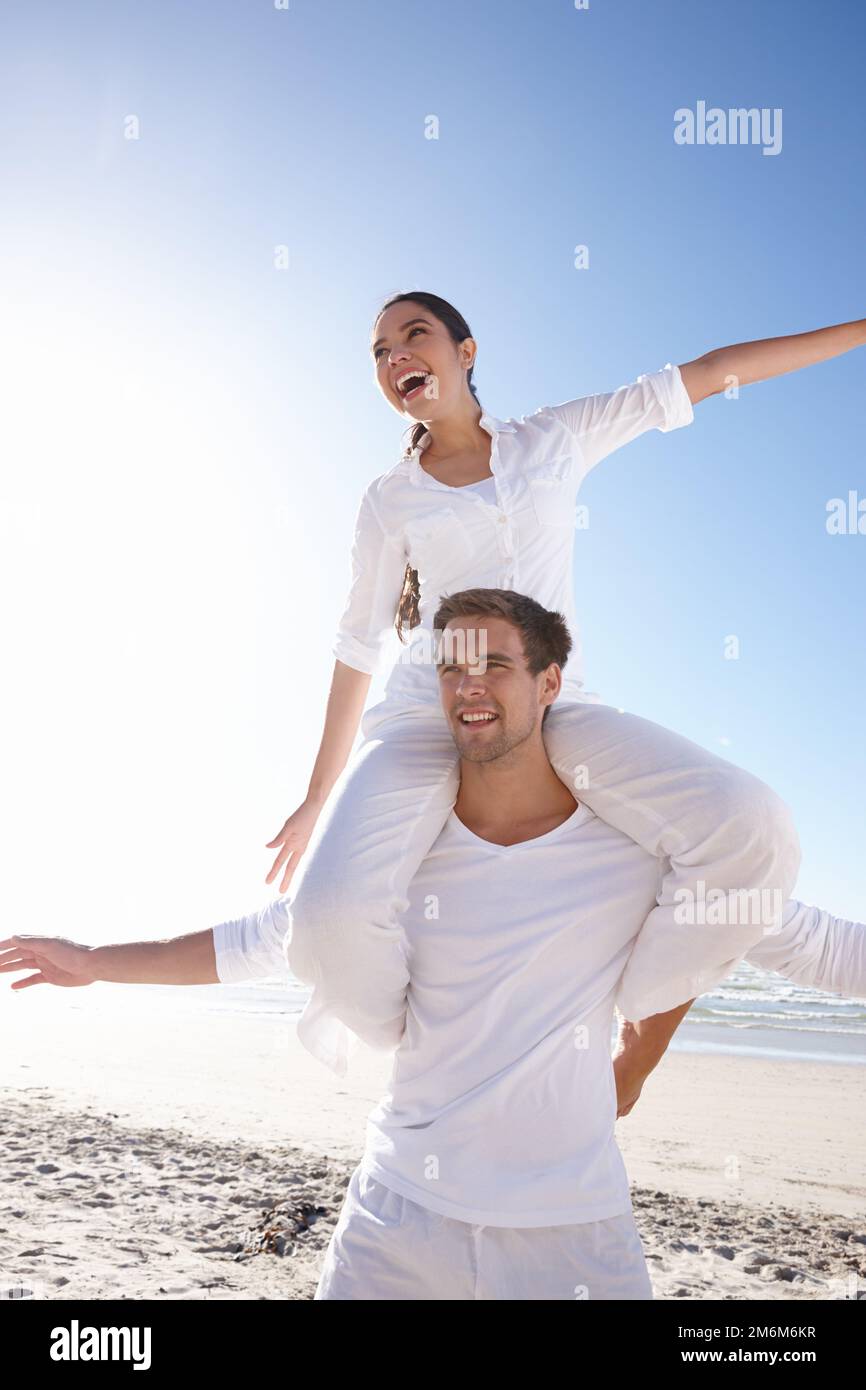 Having a fun morning with someone special. a young man carrying his ... Having a fun morning with someone special. a young man carrying his ...