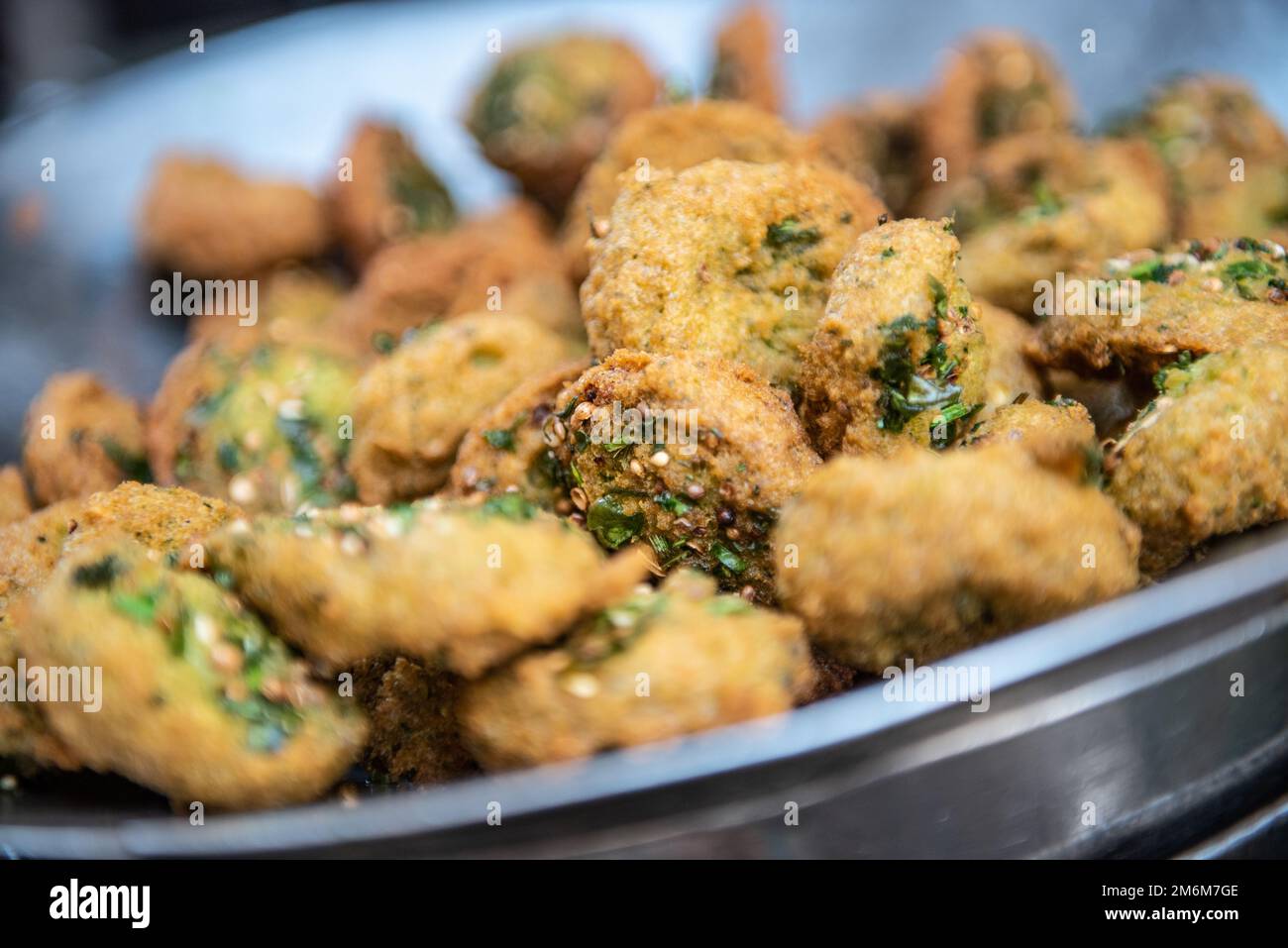 A close up detail of freshly cooked deep fried Falafel, a chickpea and ...