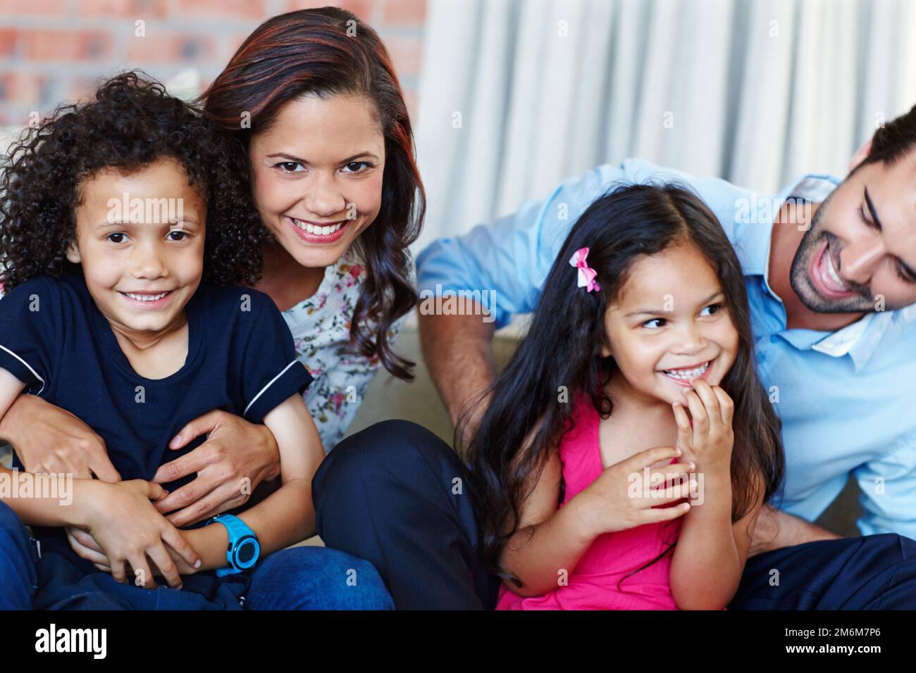 My family means everything to me. A loving family laughing together ...