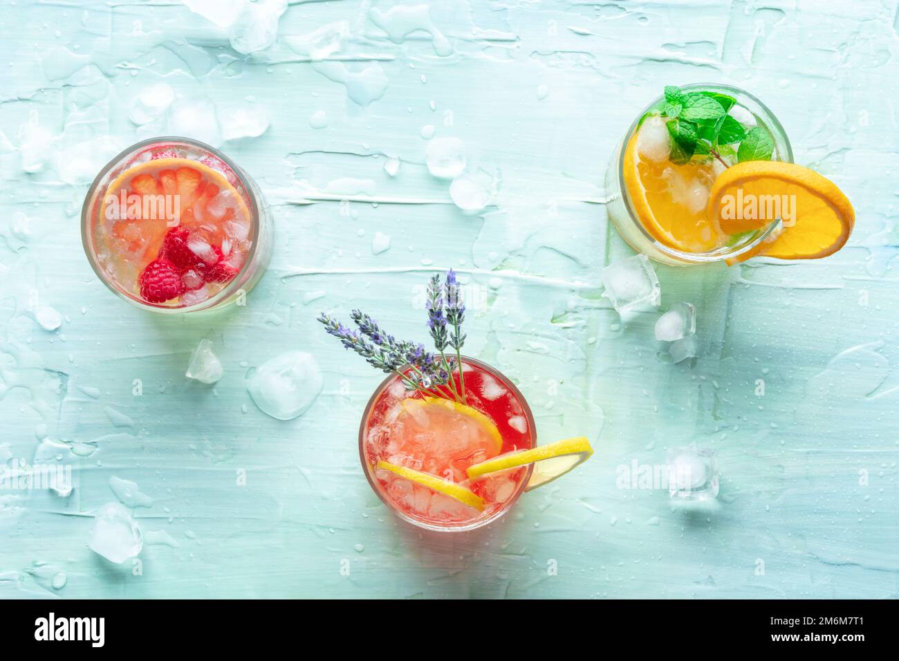 Summer cocktails or mocktails, cold drinks with citrus fruits and ...