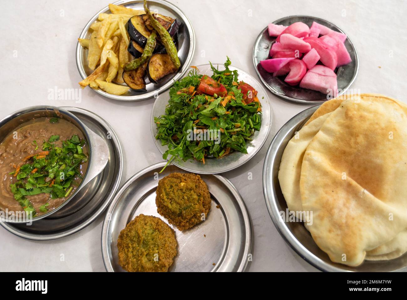 A table prepared with typical Egyptian street food of Fuul and Falafel ...