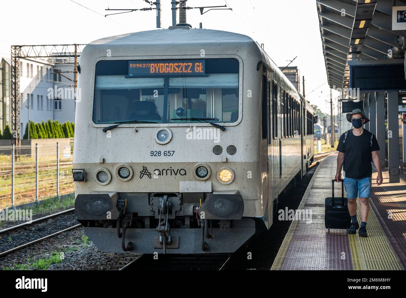 Man with a mask waiting for a train during Covid19 pandemic Stock Photo ...