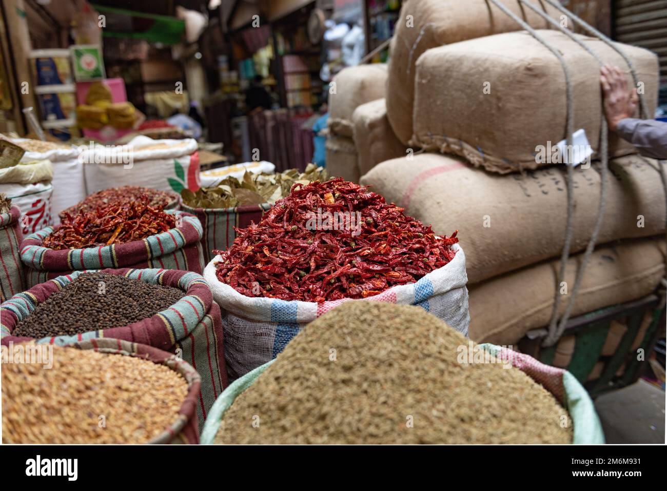 A sack of dried red chilli peppers being sold in the spice market close ...