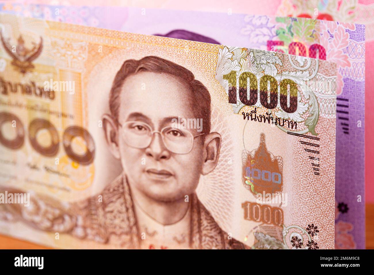 Thai money - baht a background Stock Photo - Alamy
