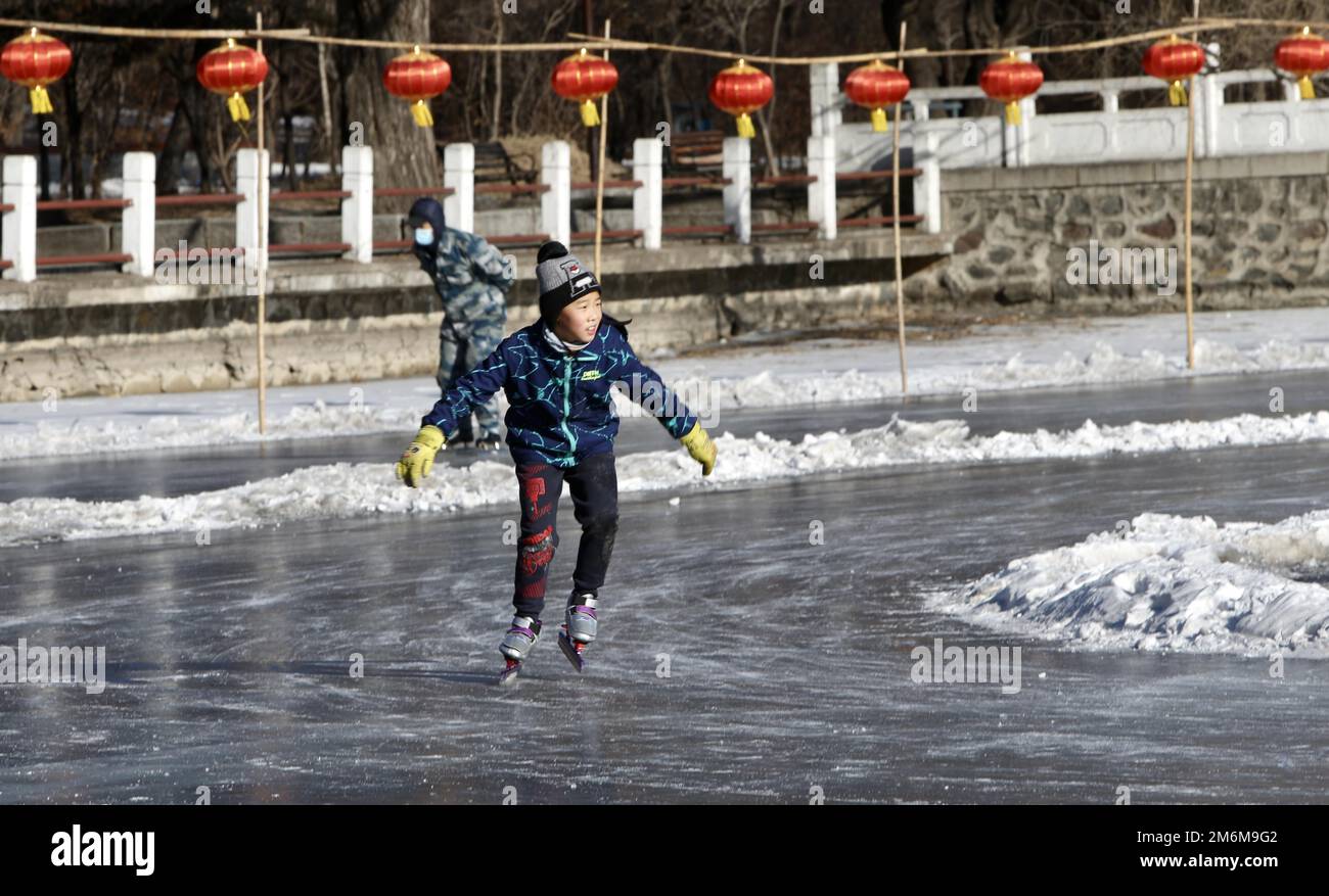 Visitors play in the Ice and Snow World of Beiling Park in Shenyang ...