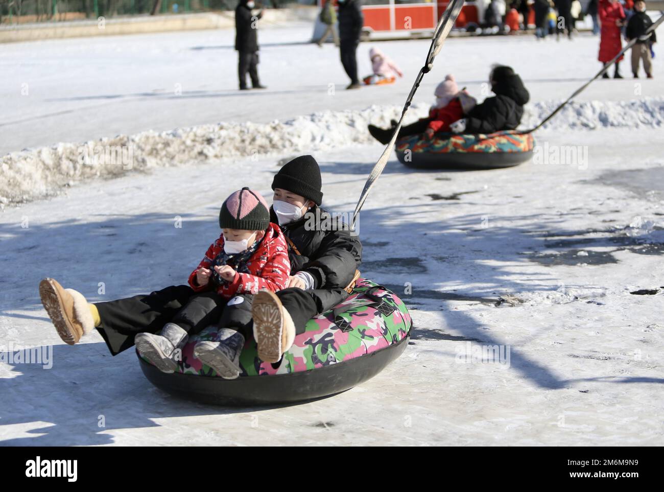 Visitors play in the Ice and Snow World of Beiling Park in Shenyang ...