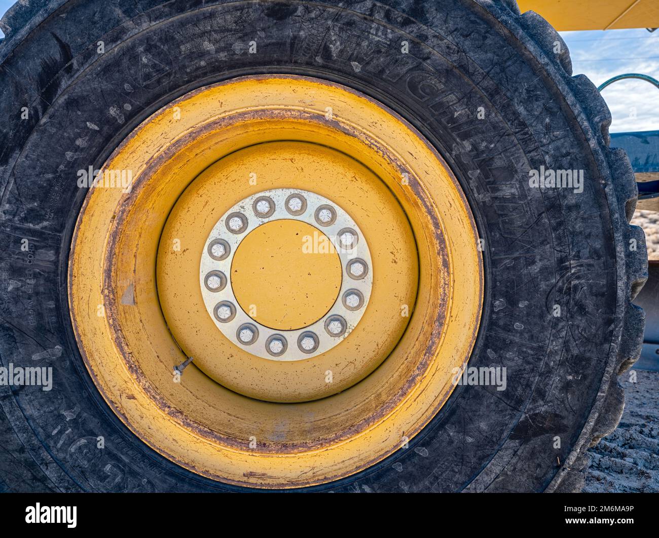 Detail of a large tire on a John Deere 872G Motor Grader parked near ...