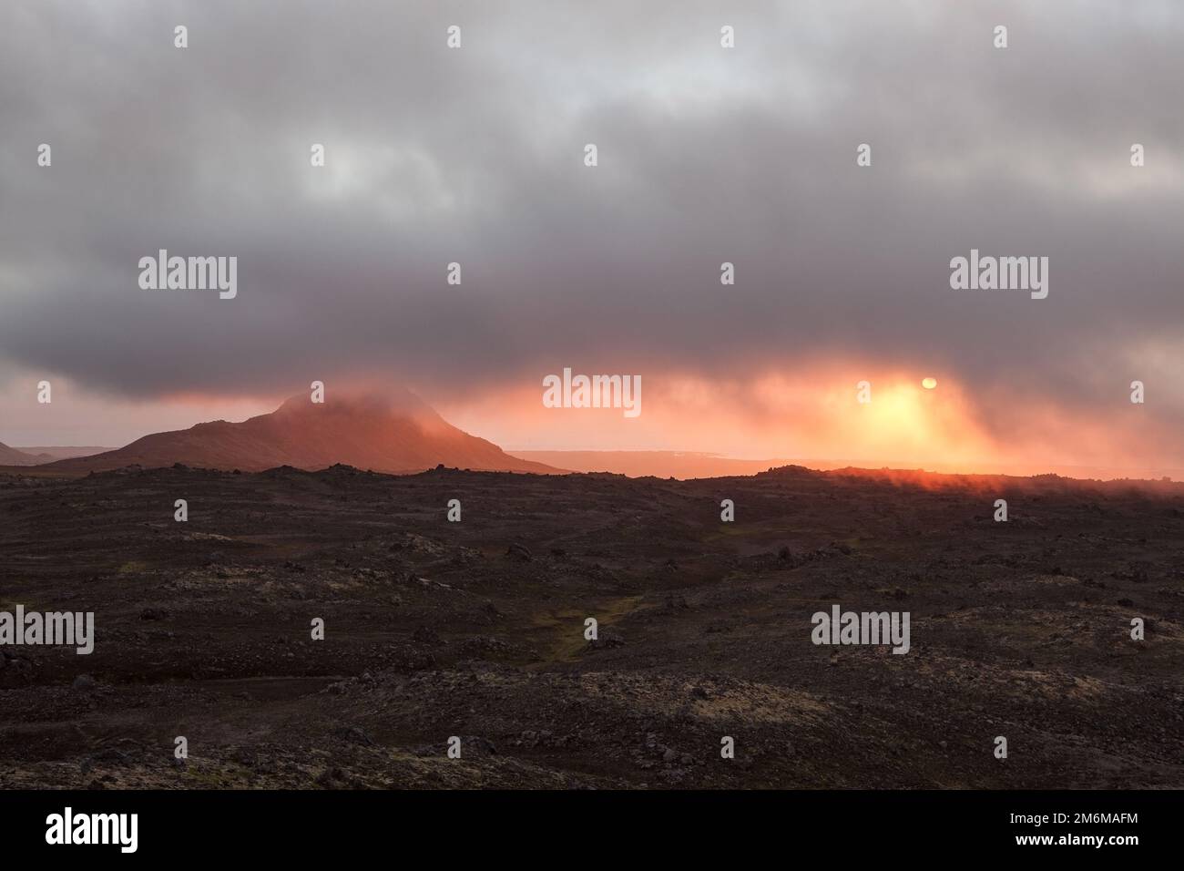 Beautiful sunset in empty lava field in Iceland. Deserted lava field ...