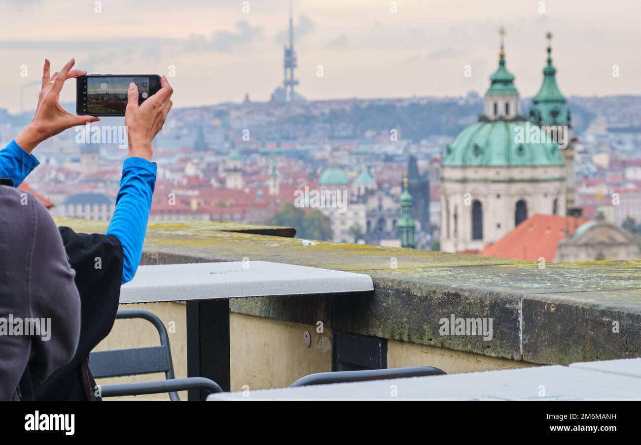 Tourist woman take picture of cityscape smartphone Top Panoramic city ...