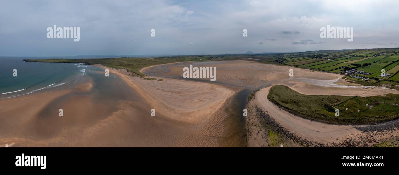 A panorama drone landscape view of the beautiful golden sand beach at ...
