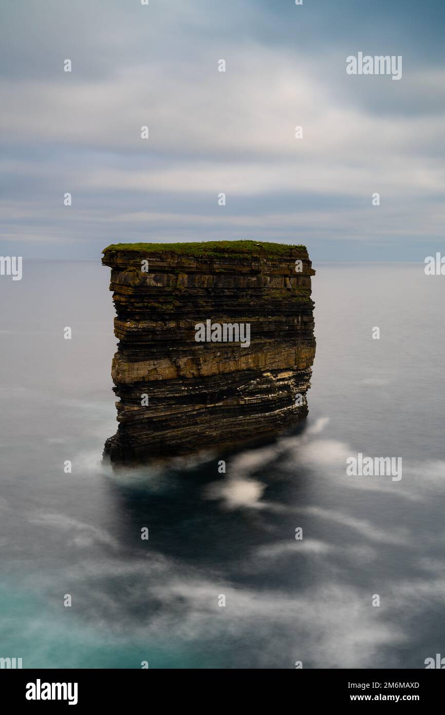 Long exposure view of the landmark sea stack Downpatrick Head in County ...