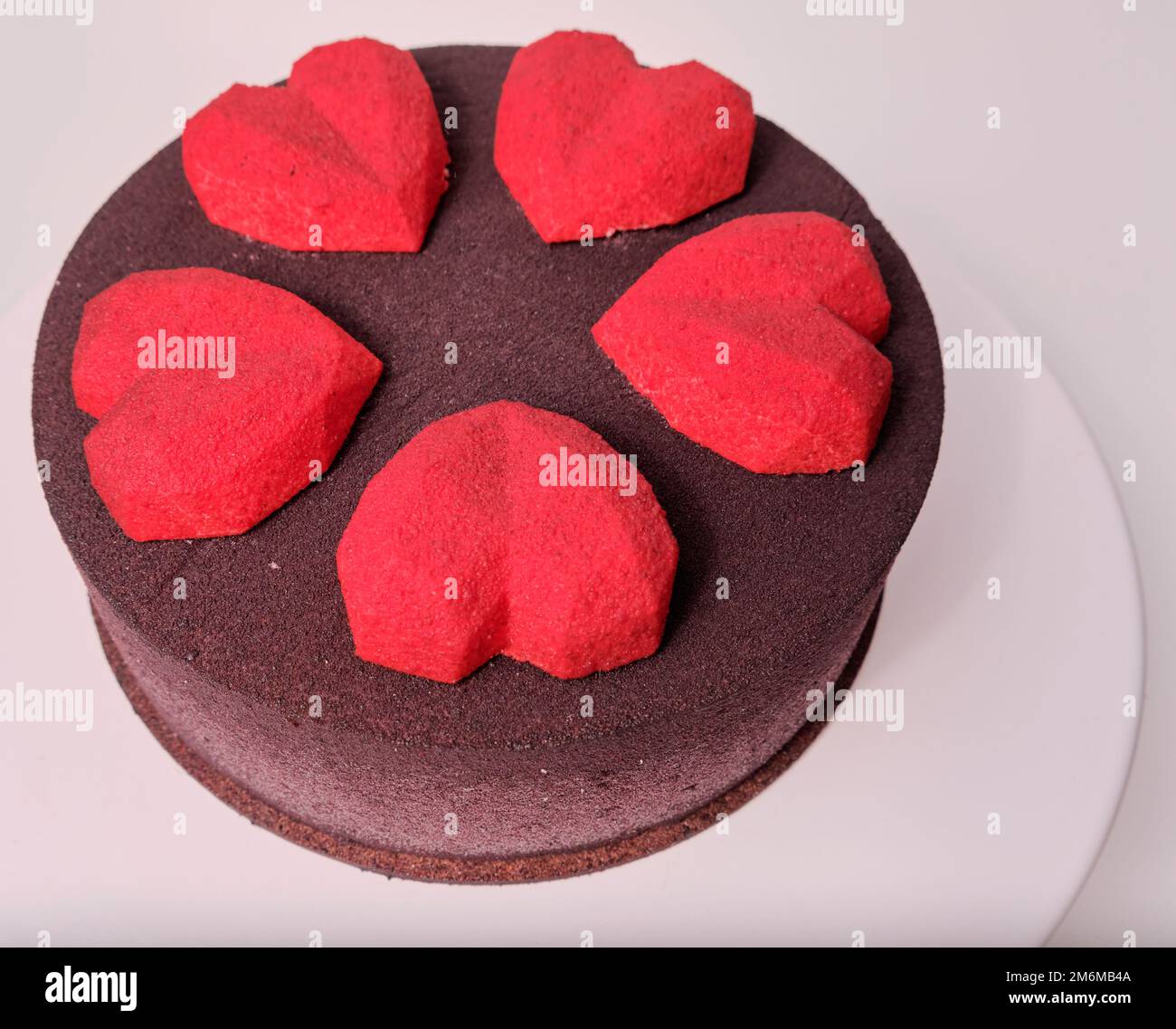 mousse cake chocolate brown with red mirror glaze in the shape of a ...