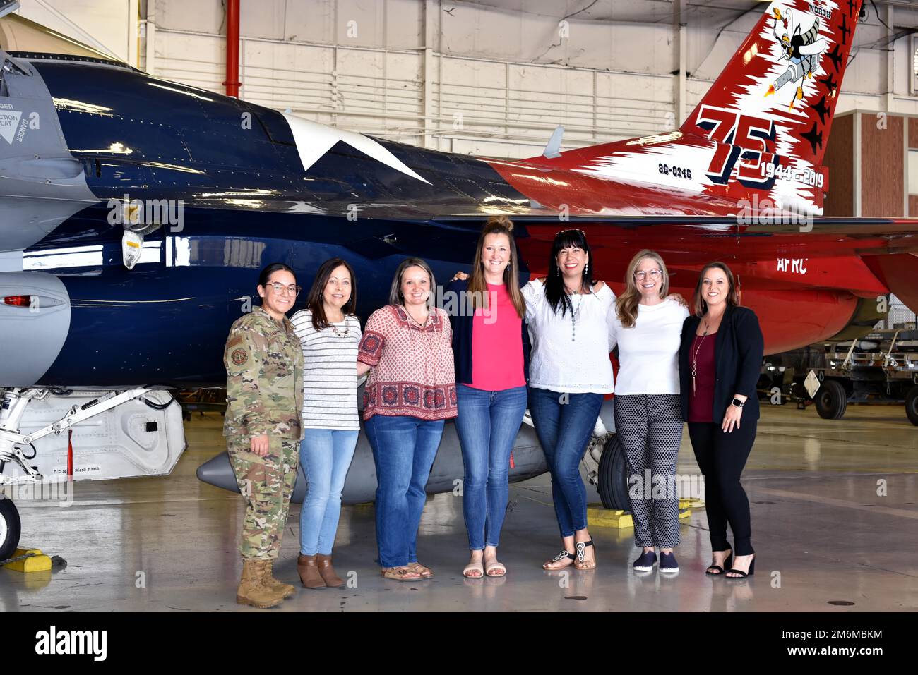 Key Volunteers stand next to the 301st Fighter Wing Heritage F-16 ...
