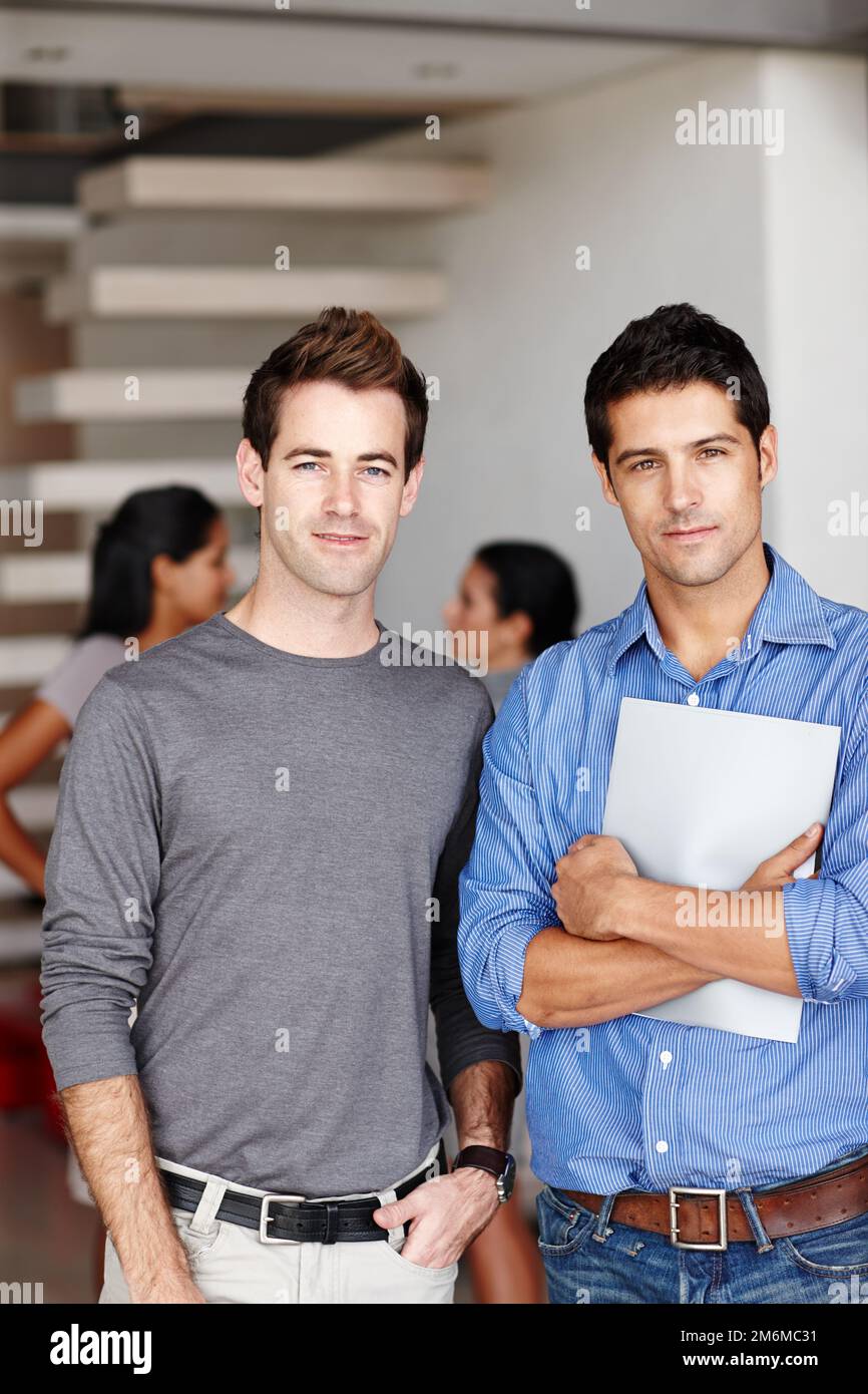 Successful designers. Portrait of two creative associates standing ...