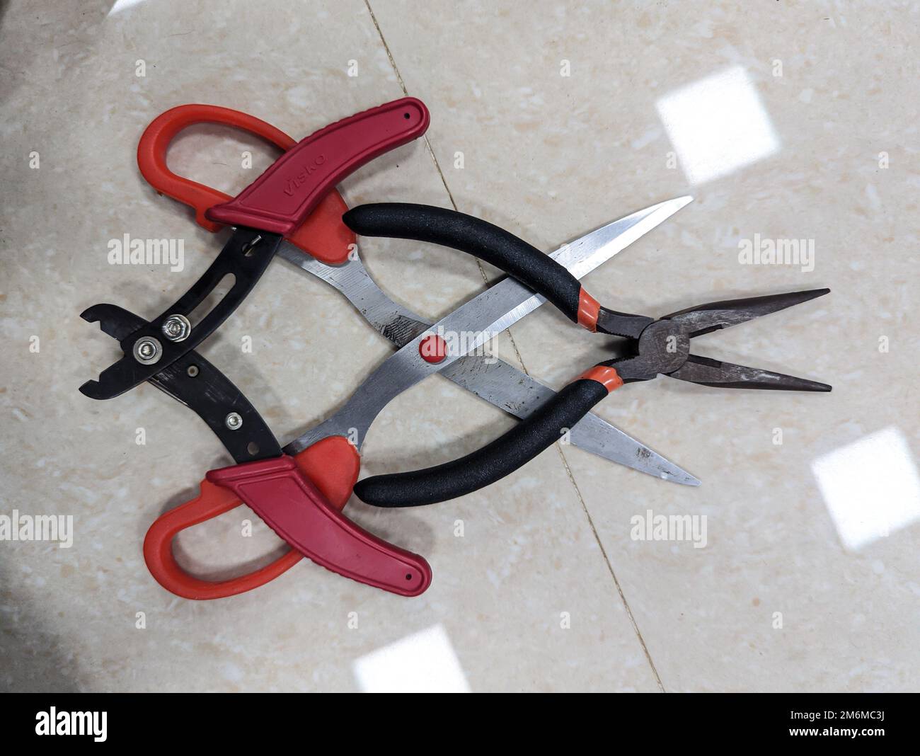 various cutting tools like scissor, cutting plier and wire stripper ...