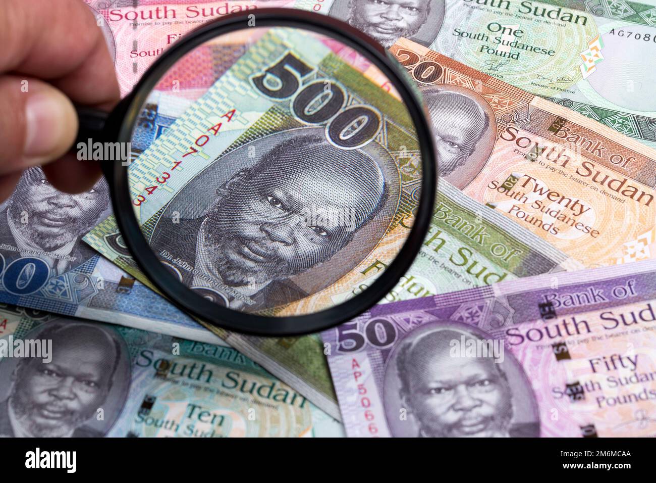 South Sudan money in a magnifying glass a business background Stock ...