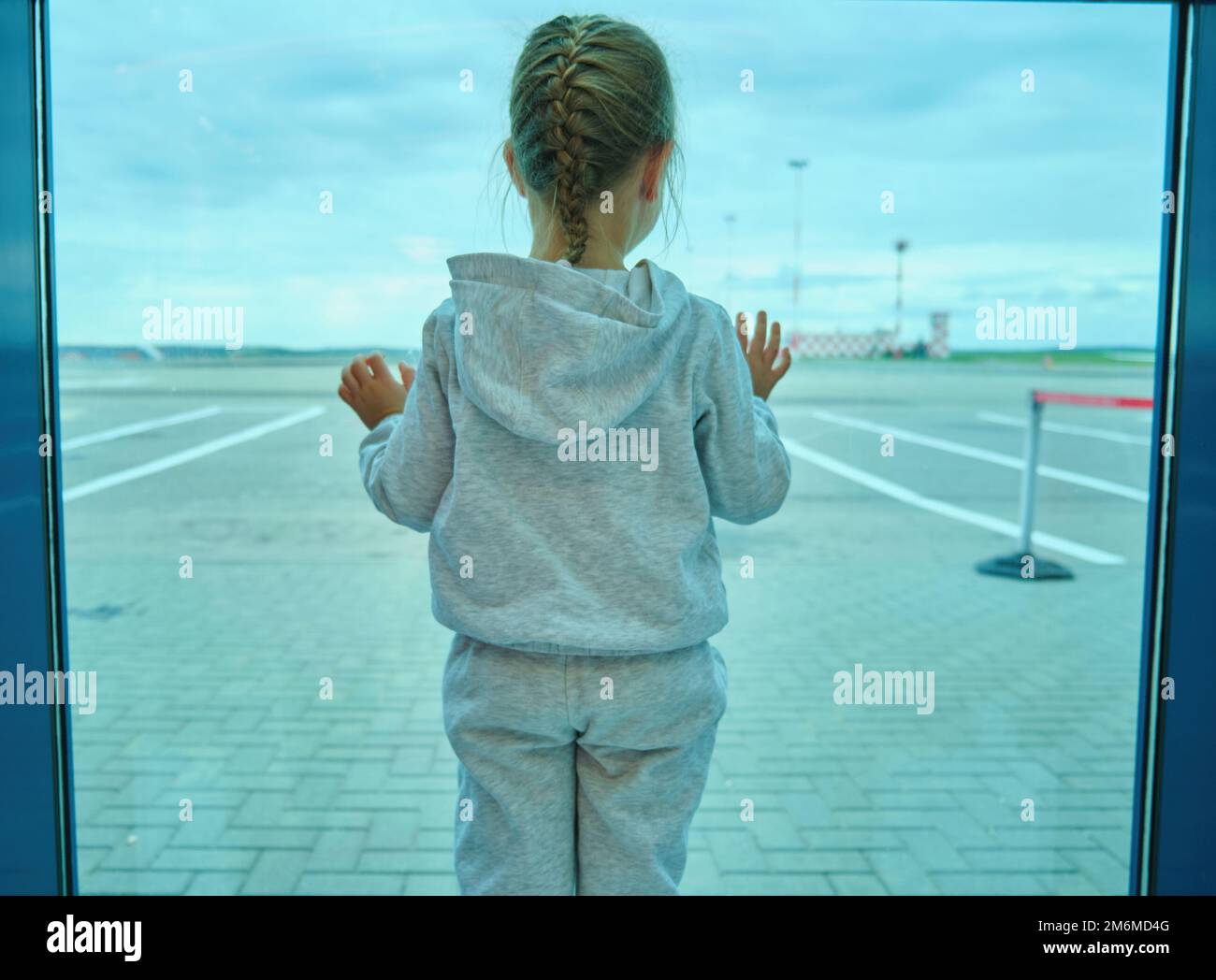preschool Little girl kid looking waiting through window to airplane in ...