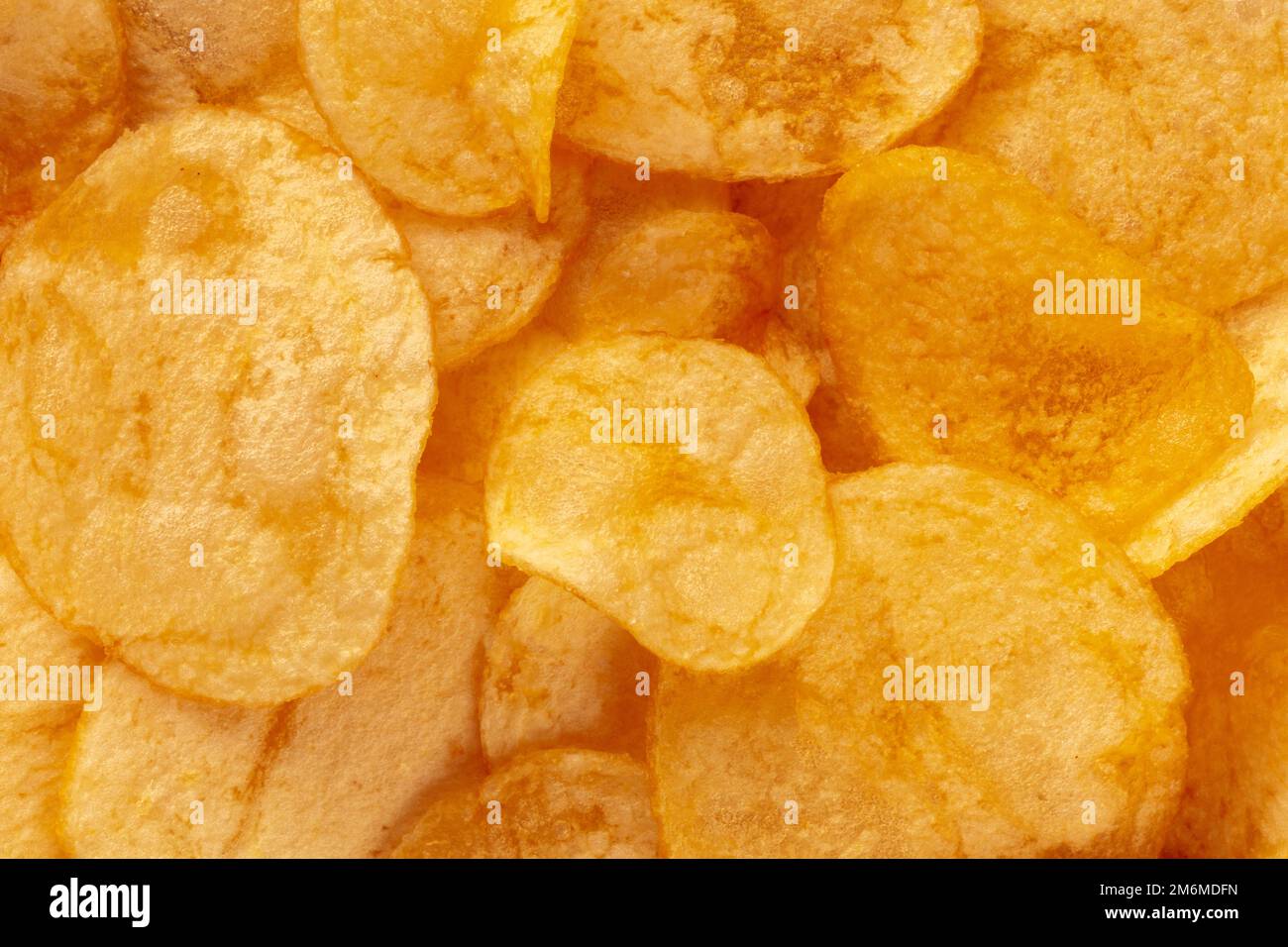 Potato chips texture, a salty snack, a pile of yellow crisps Stock ...