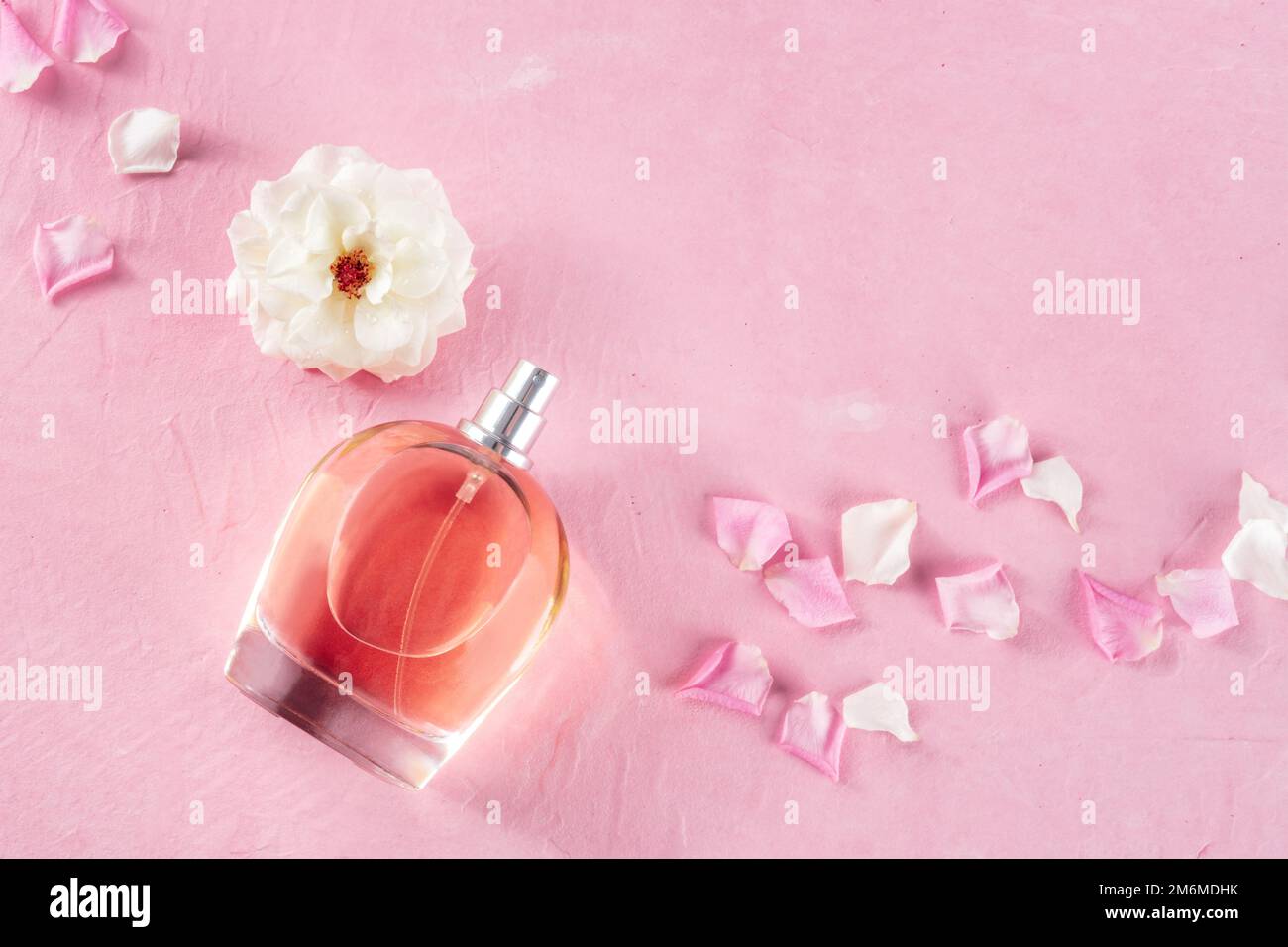 Perfume. Rose fragrance in an elegant bottle with fresh flowers Stock ...
