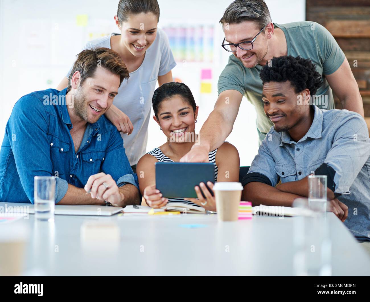 Getting some online motivation. a group of business colleagues using a ...