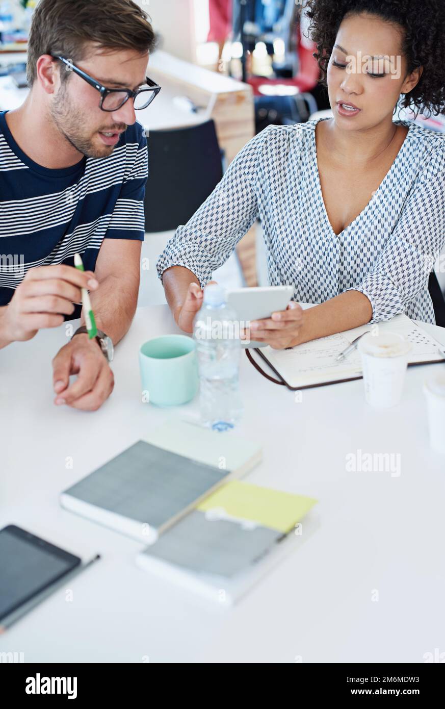 Modern tools for modern business. coworkers talking over a digital ...