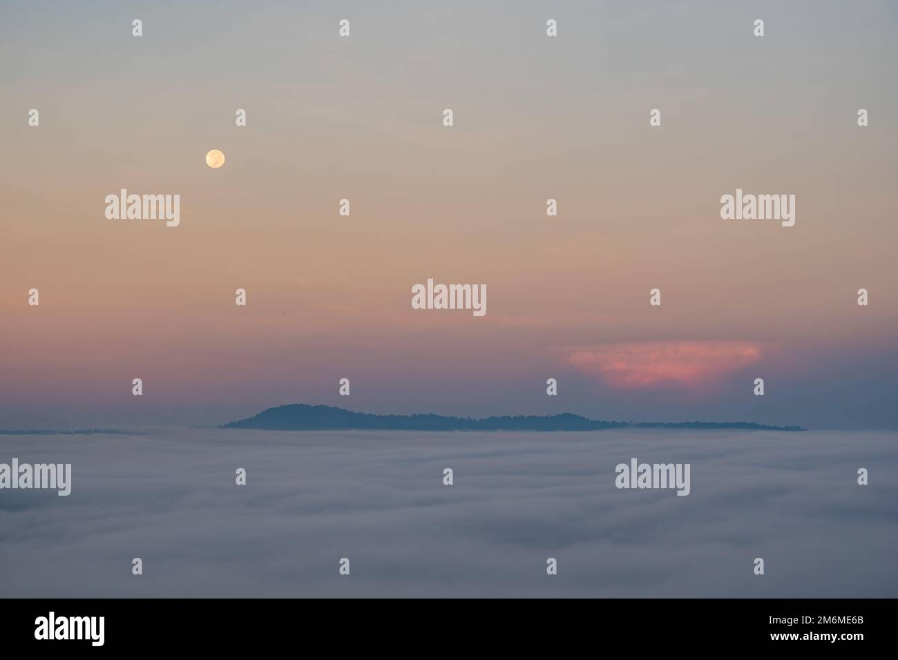 Full moon falling And the mist in the morning time. The color orange ...