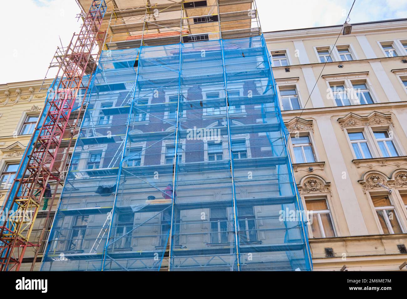 facade building under construction is covered blue protective ...