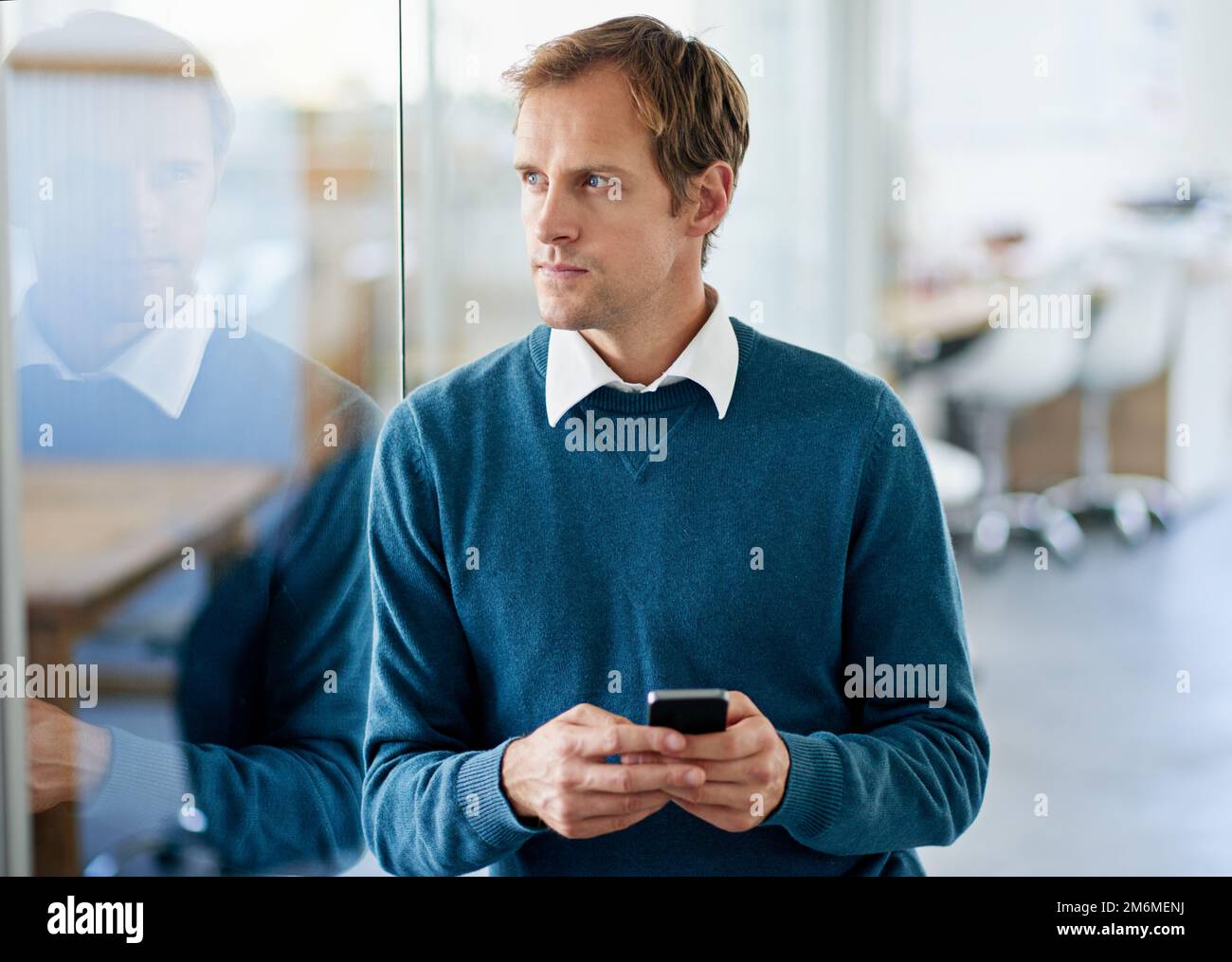 Handsome businessman thinking using digital hi-res stock photography ...