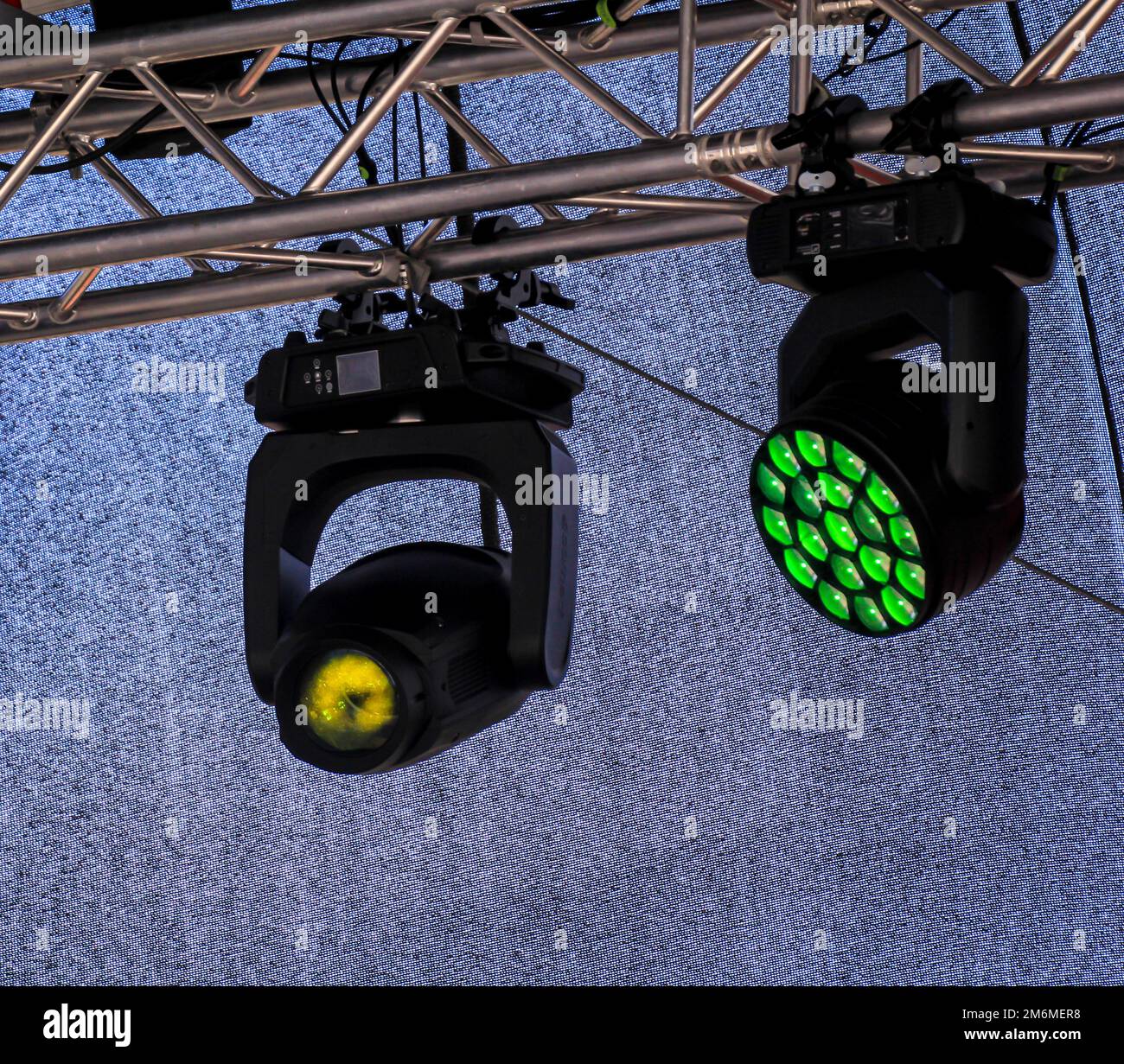A high-tech concert spotlight hangs from a support system Stock Photo ...