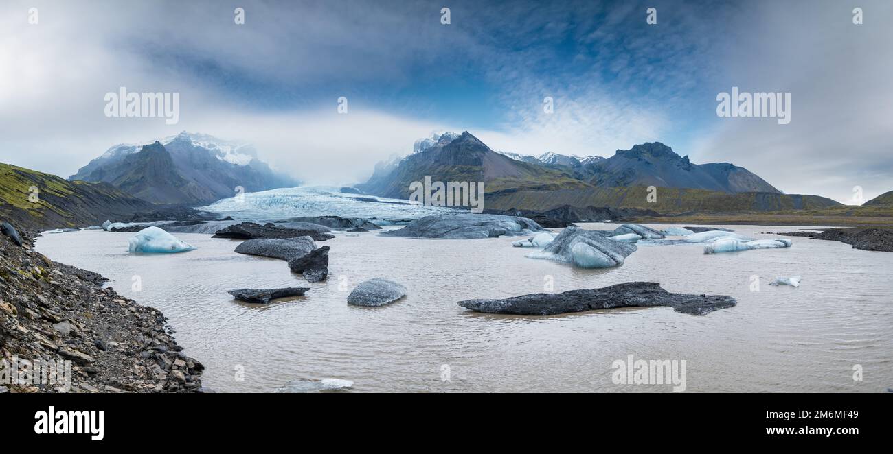 Glacier tongue slides from the Vatnajokull icecap or Vatna Glacier near ...