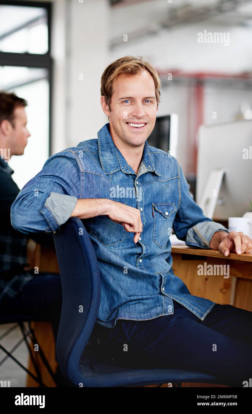 Ready to put your designs into reality. Portrait of a designer sitting ...