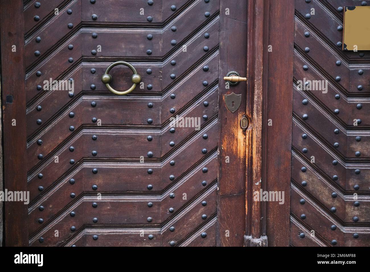 Old door of a solid wood house Wooden doors in ancient medieval design ...