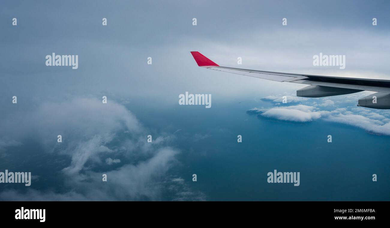 The plane under the wing of the sky Stock Photo - Alamy