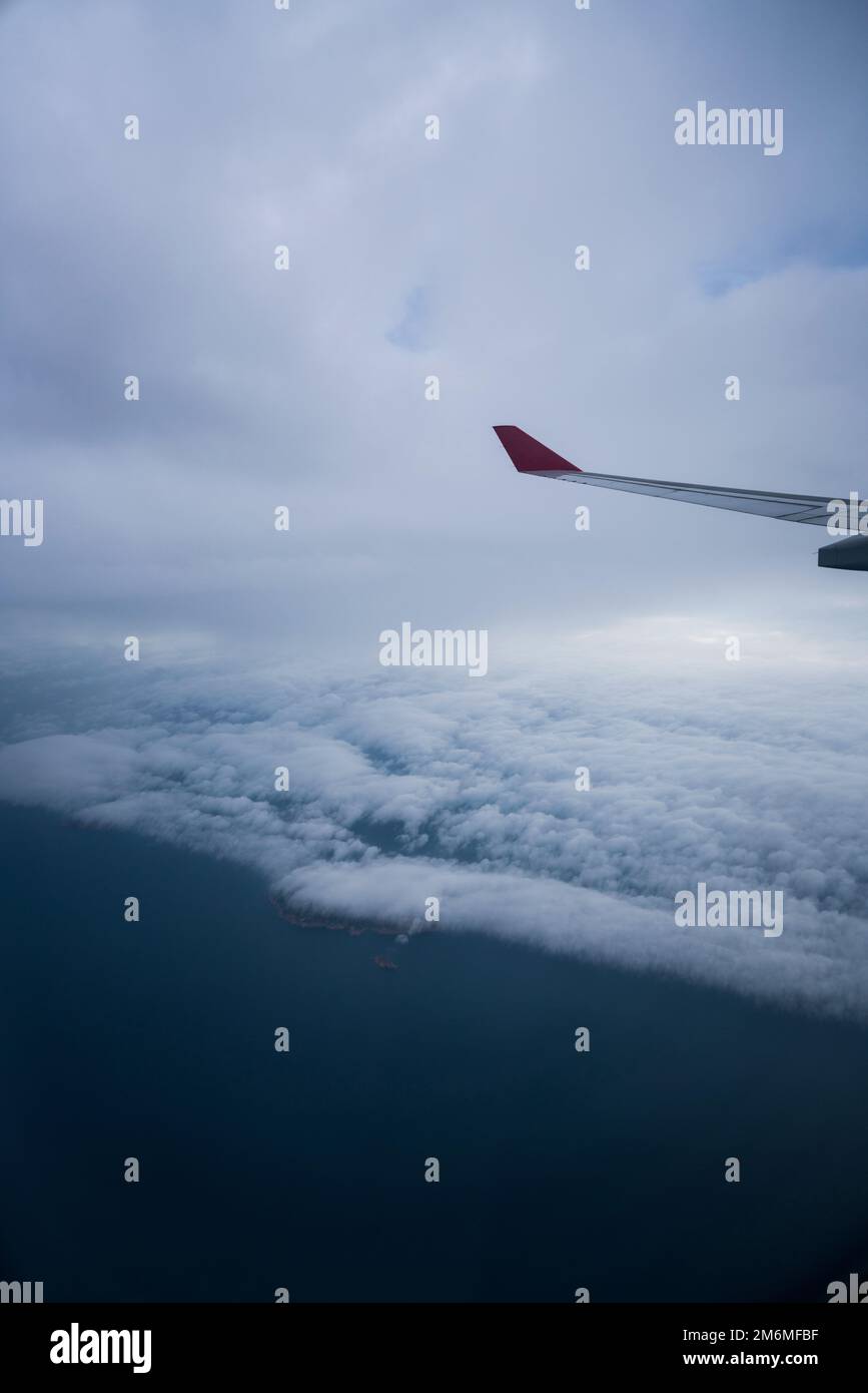 The plane under the wing of the sky Stock Photo - Alamy