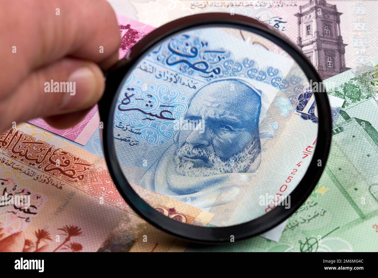 Libyan dinar in a magnifying glass a business background Stock Photo ...