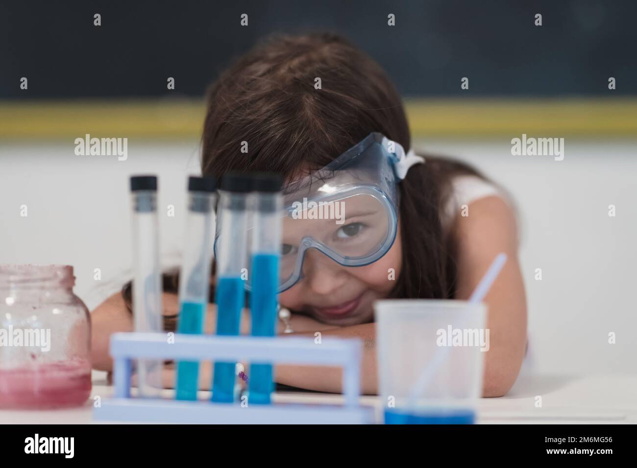 Elementary School Science Classroom: Little girl Mixes Chemicals in ...