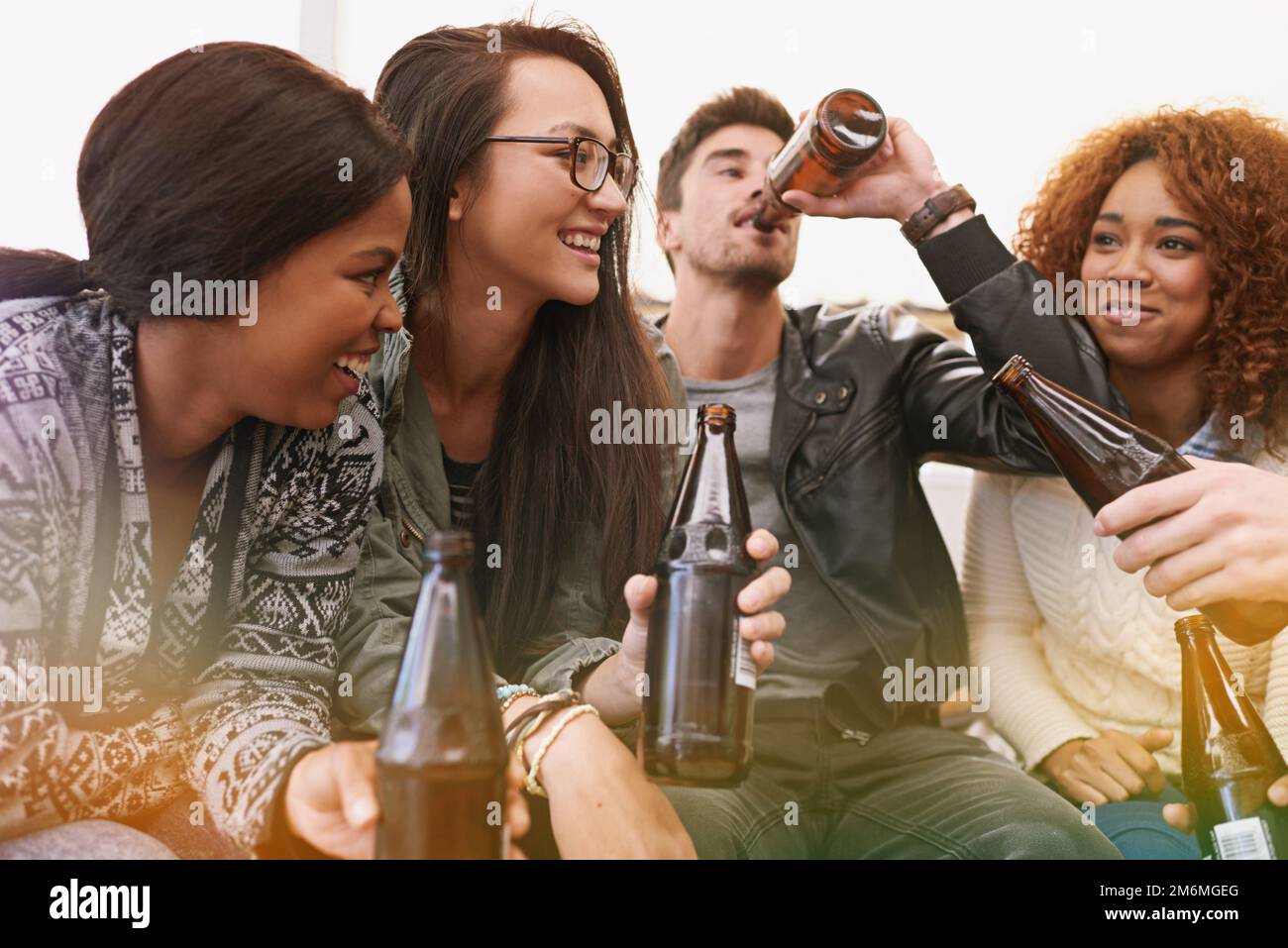 Relaxing with a few drinks. a group of friends drinking outdoors Stock ...
