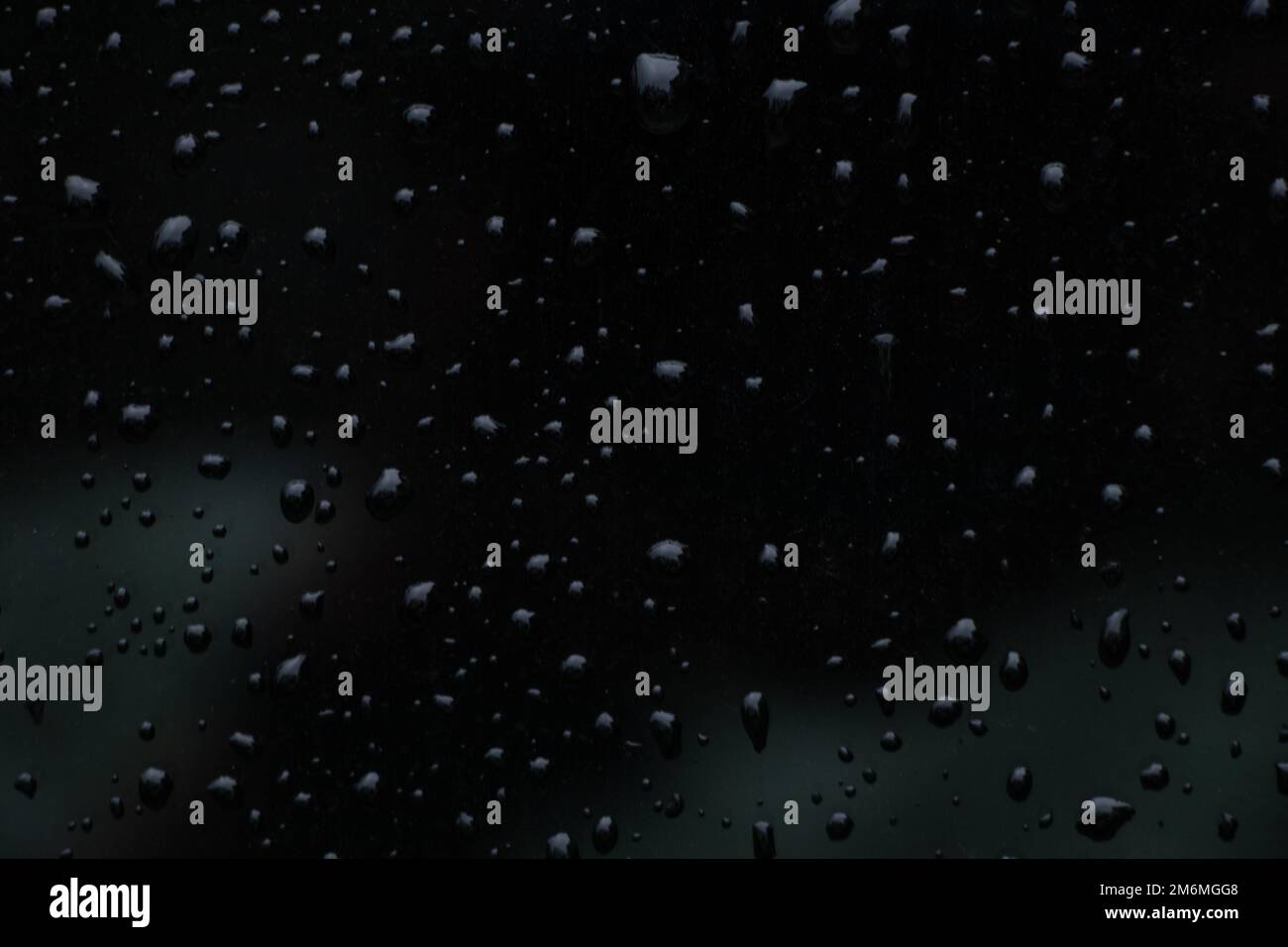 drops of water on a dark gray background Stock Photo - Alamy