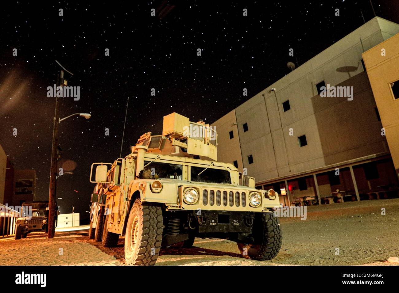 A Humvee idles in a combat town during Marine Air Ground Task Force ...