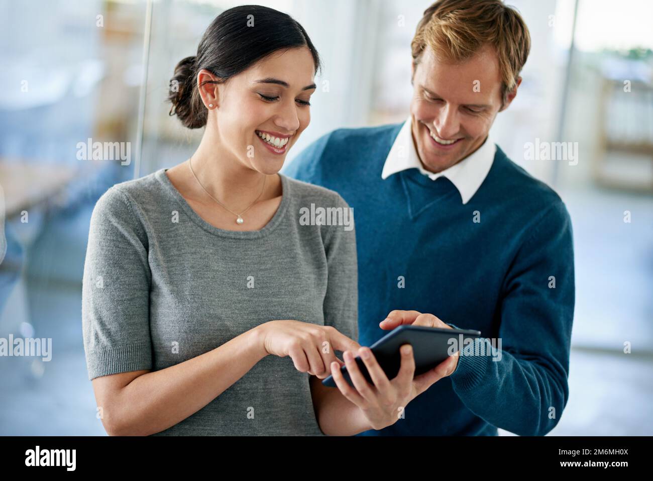 Technology is their third team mate. two colleagues using a digital ...