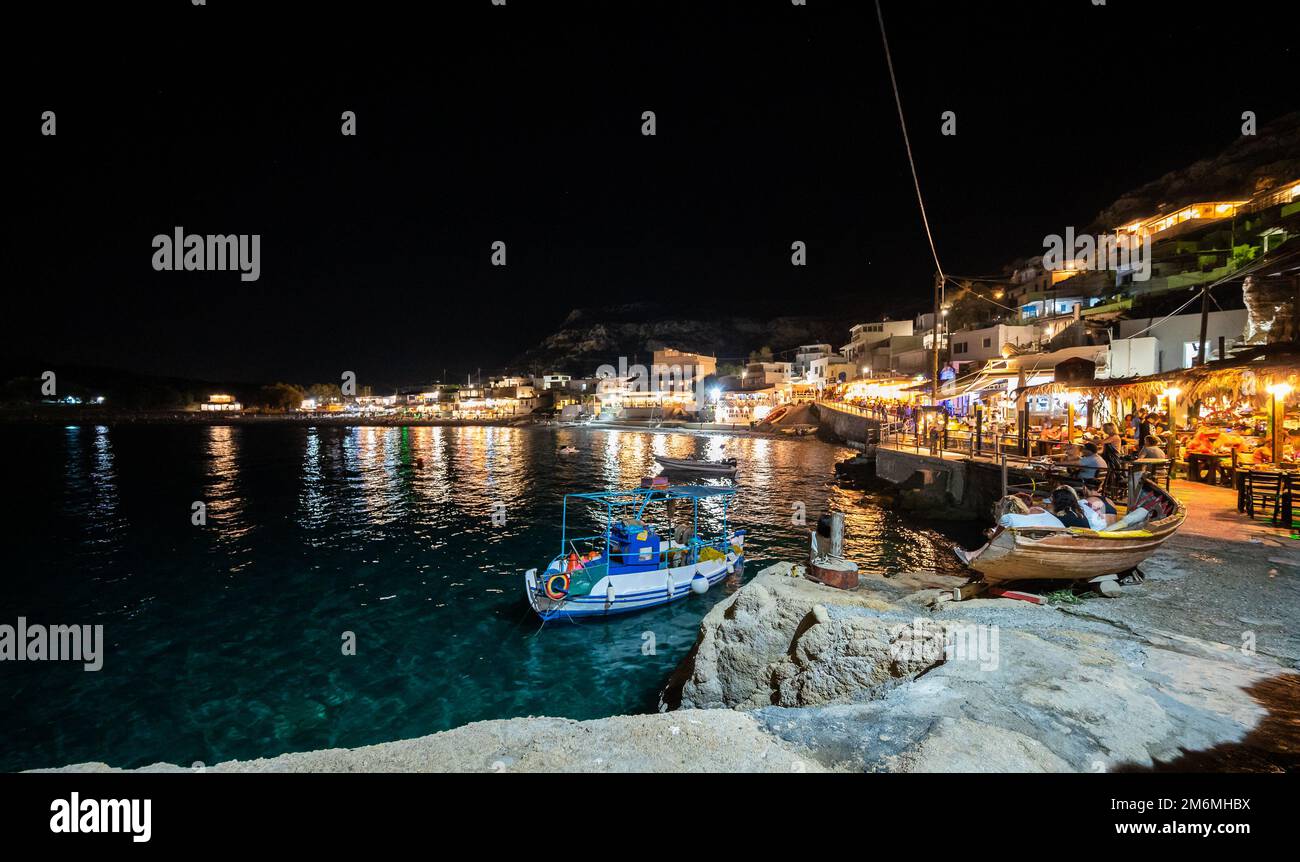 Night view of Matala village restaurants in Crete, Greece. Nightscape ...